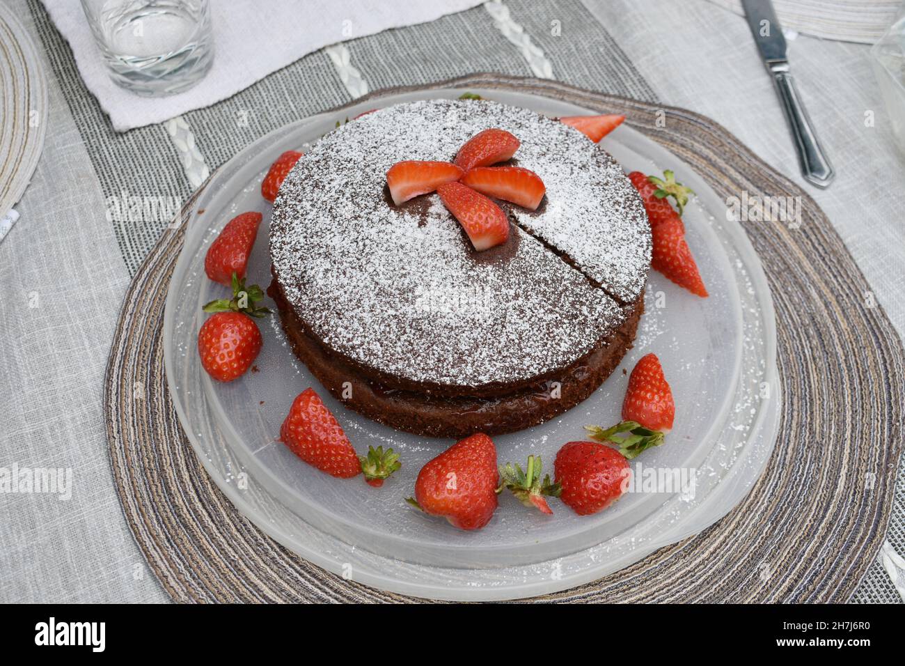 home made chocolate Victoria sandwich cake with fresh red strawberries ...