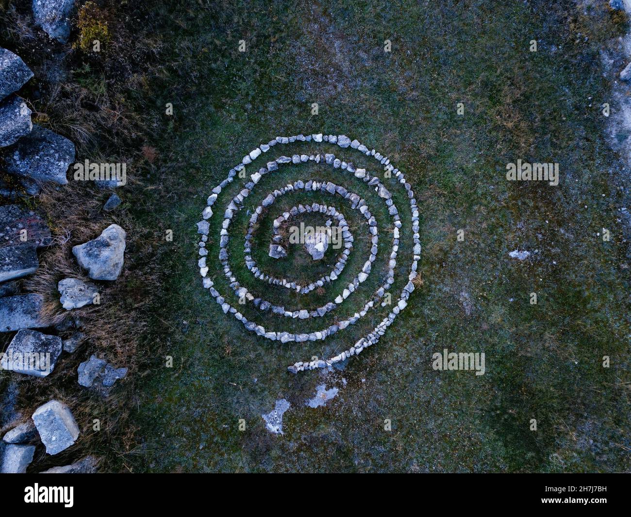 Spiral labyrinth made of stones, top view from drone Stock Photo - Alamy
