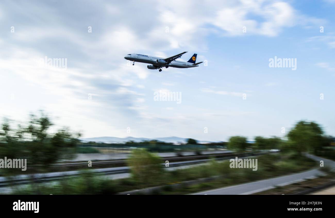 BARCELONA, SPAIN - Oct 25, 2021: Big passenger airline plane in the sky ...