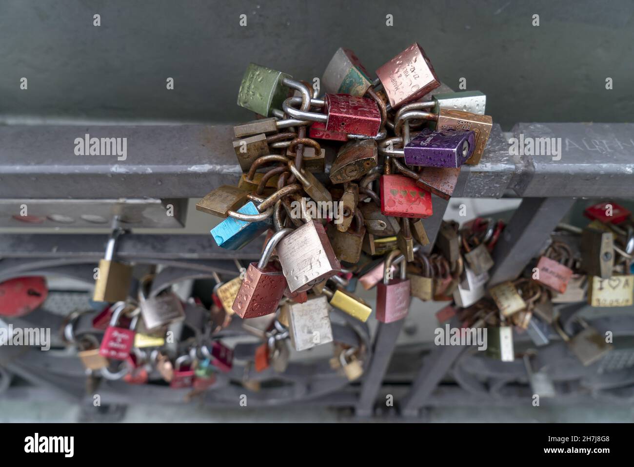 Close-up shot of many locks attached to the railings of a bridge Stock ...