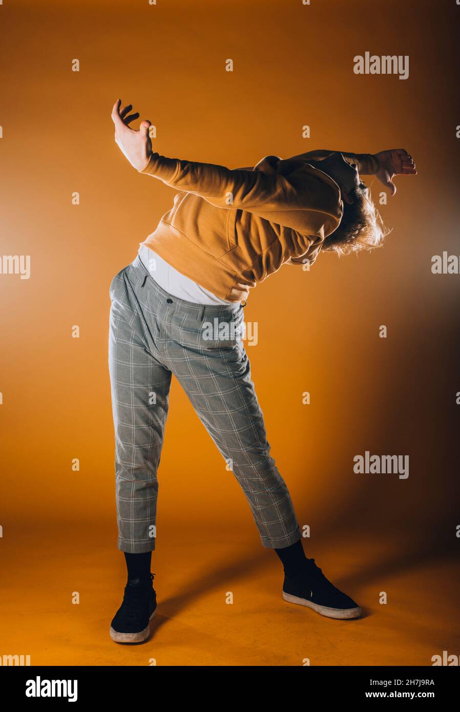 Dance moves performed by an acrobatic flexible male dancer Stock Photo ...