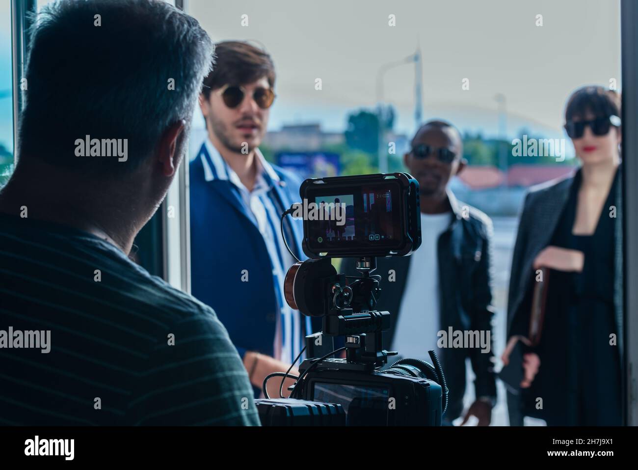 Professional videographer filming interview hi-res stock photography ...