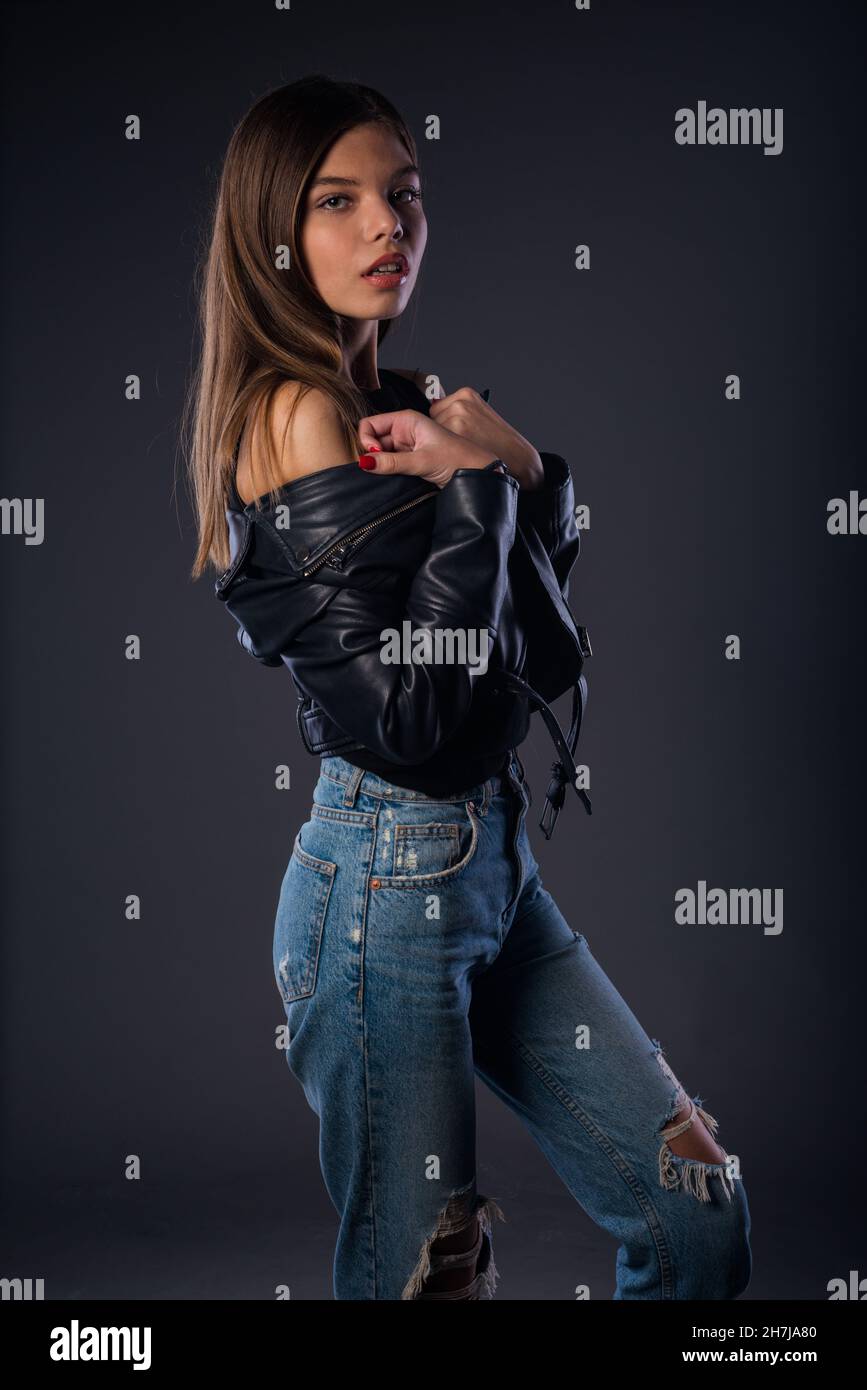 Body shot of an attractive female model posing in modern style clothes ...