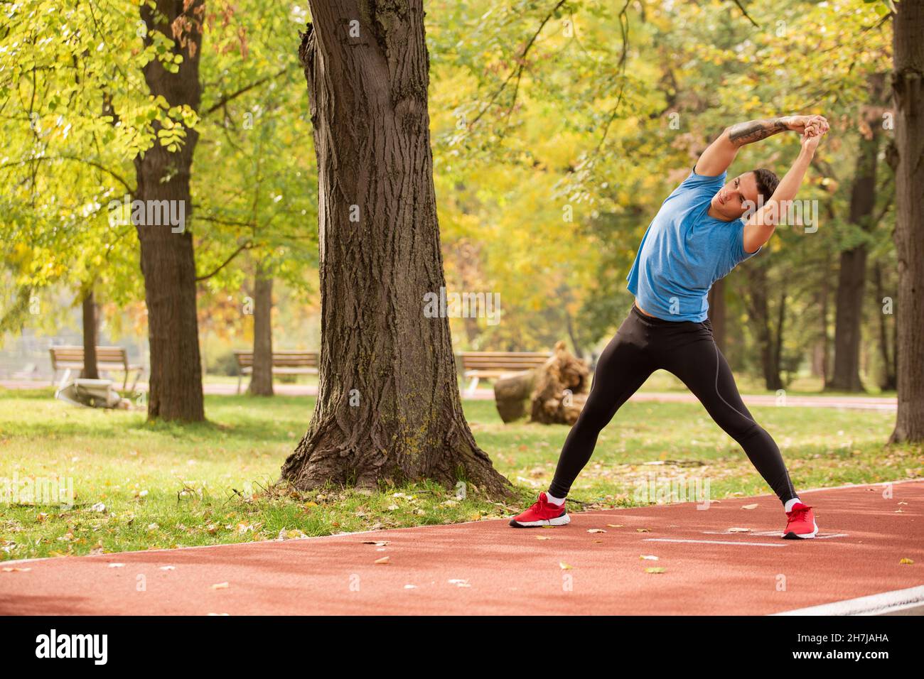 Thinking man runner stretching hi-res stock photography and images - Alamy