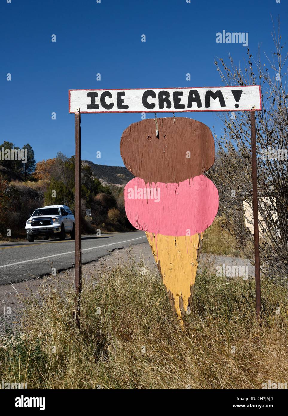 A handmade roadside sign in front of a small restaurant in Dixon, New ...