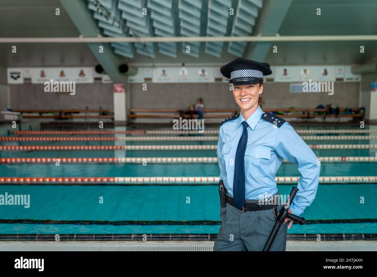 female police officer in uniform at the swimming pool Stock Photo - Alamy