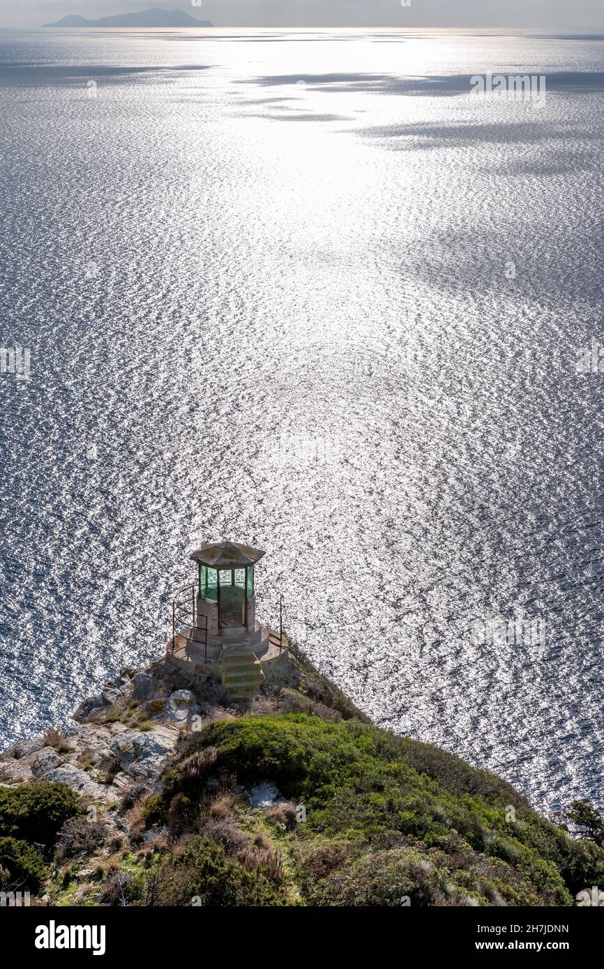 Watchtower on the island of Gorgona, with the island of Capraia in the ...