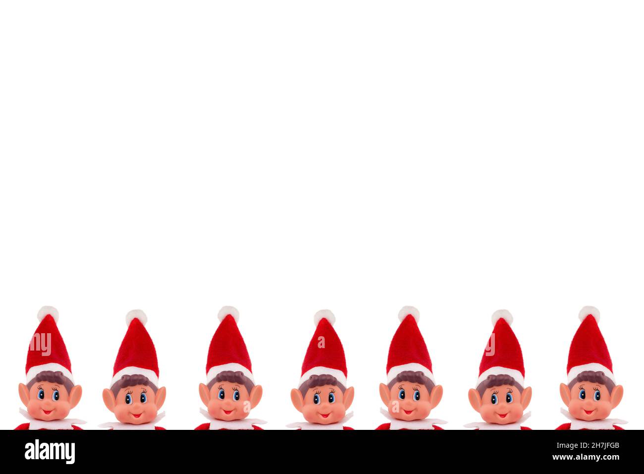 Christmas Elf toy peeking heads on an isolated white background with ...