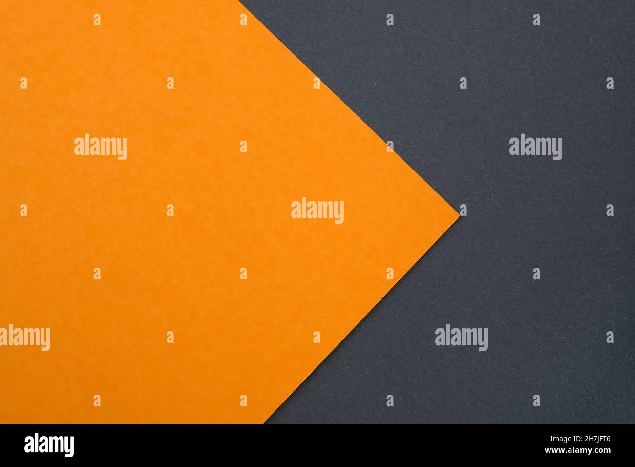 Abstract background from sheets of orange, and black paper. Orange ...