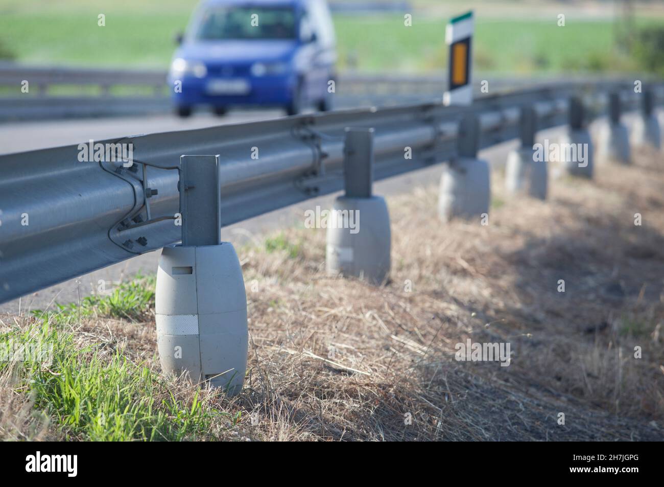 Guardrails poles covered with crash-absorber cylinder. Motorbikers ...