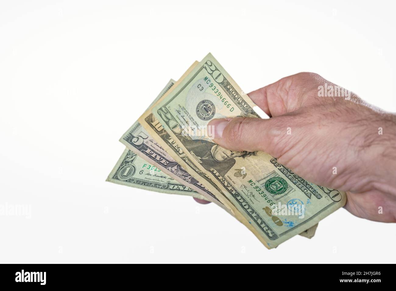 Hand giving or paying money, US dollar bills Stock Photo - Alamy