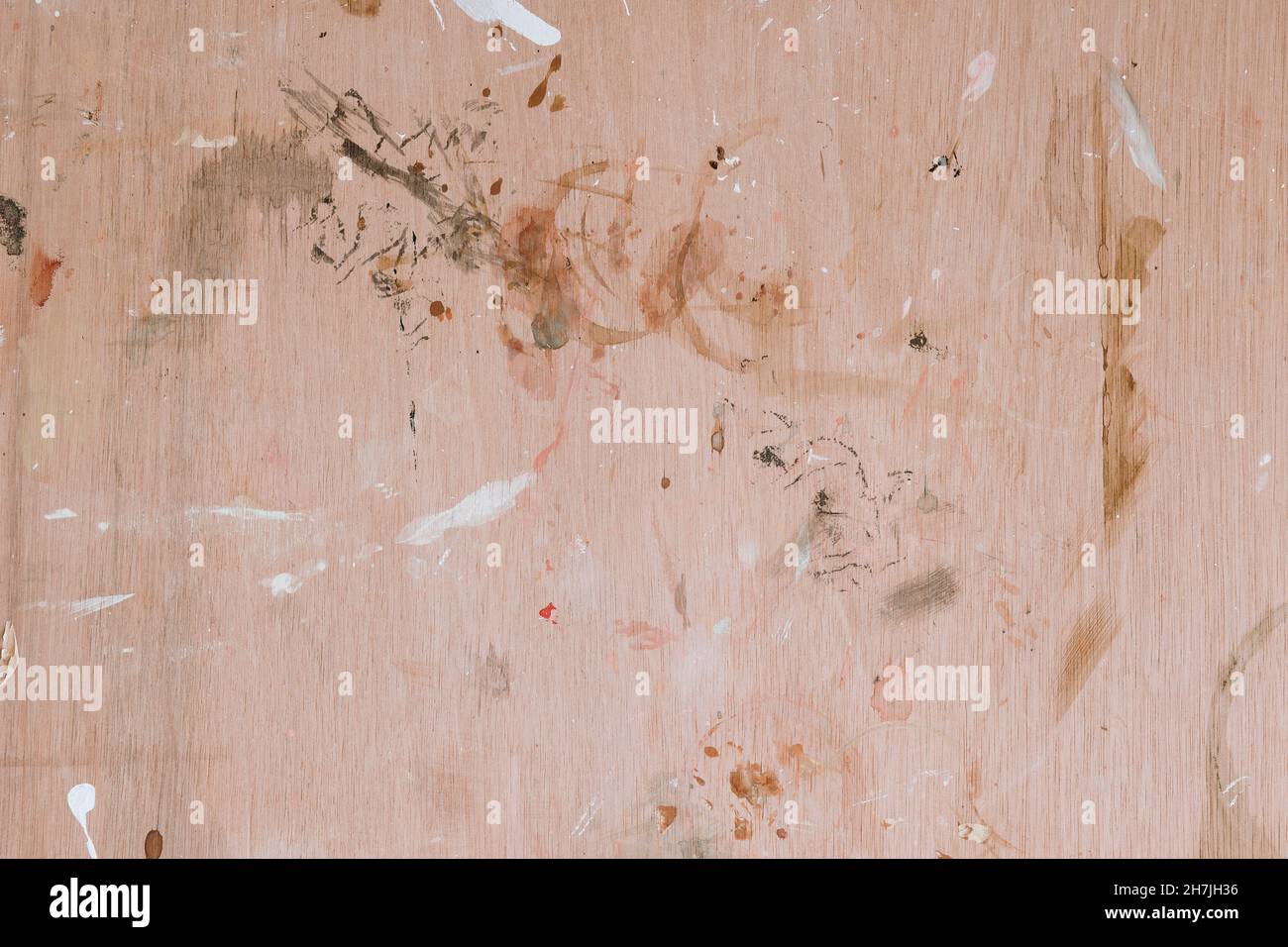 Colorful paint splashes on wooden board. Flat lay, top view. Abstract ...