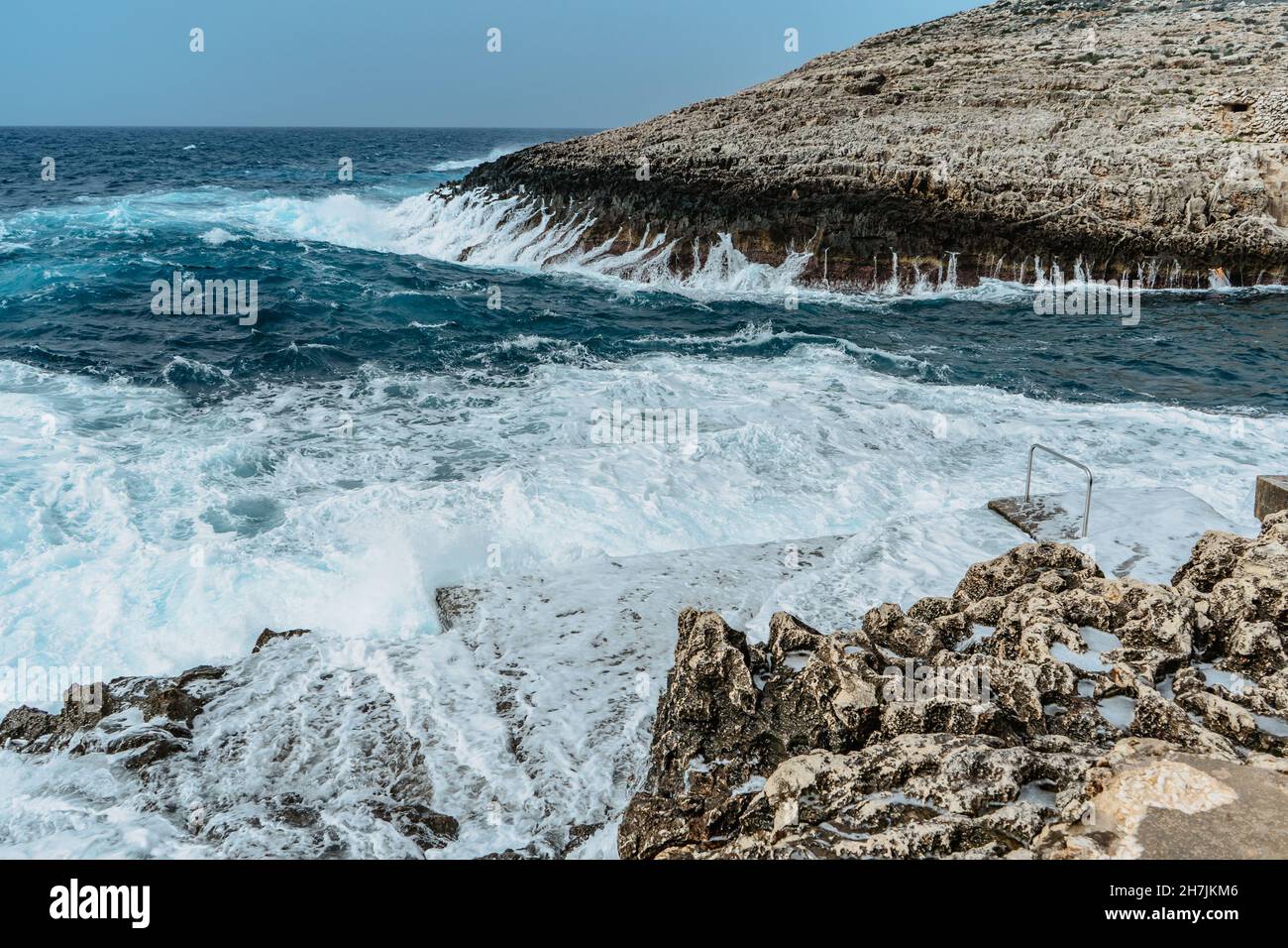 View of rocky seashore,Malta.Turquoise clear water of Mediterranean Sea ...
