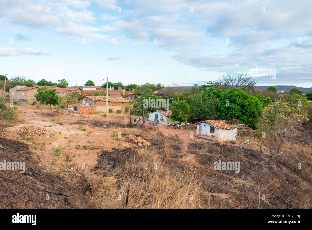 Poorly made houses with broken ceramic roof tiles in a settlement by ...