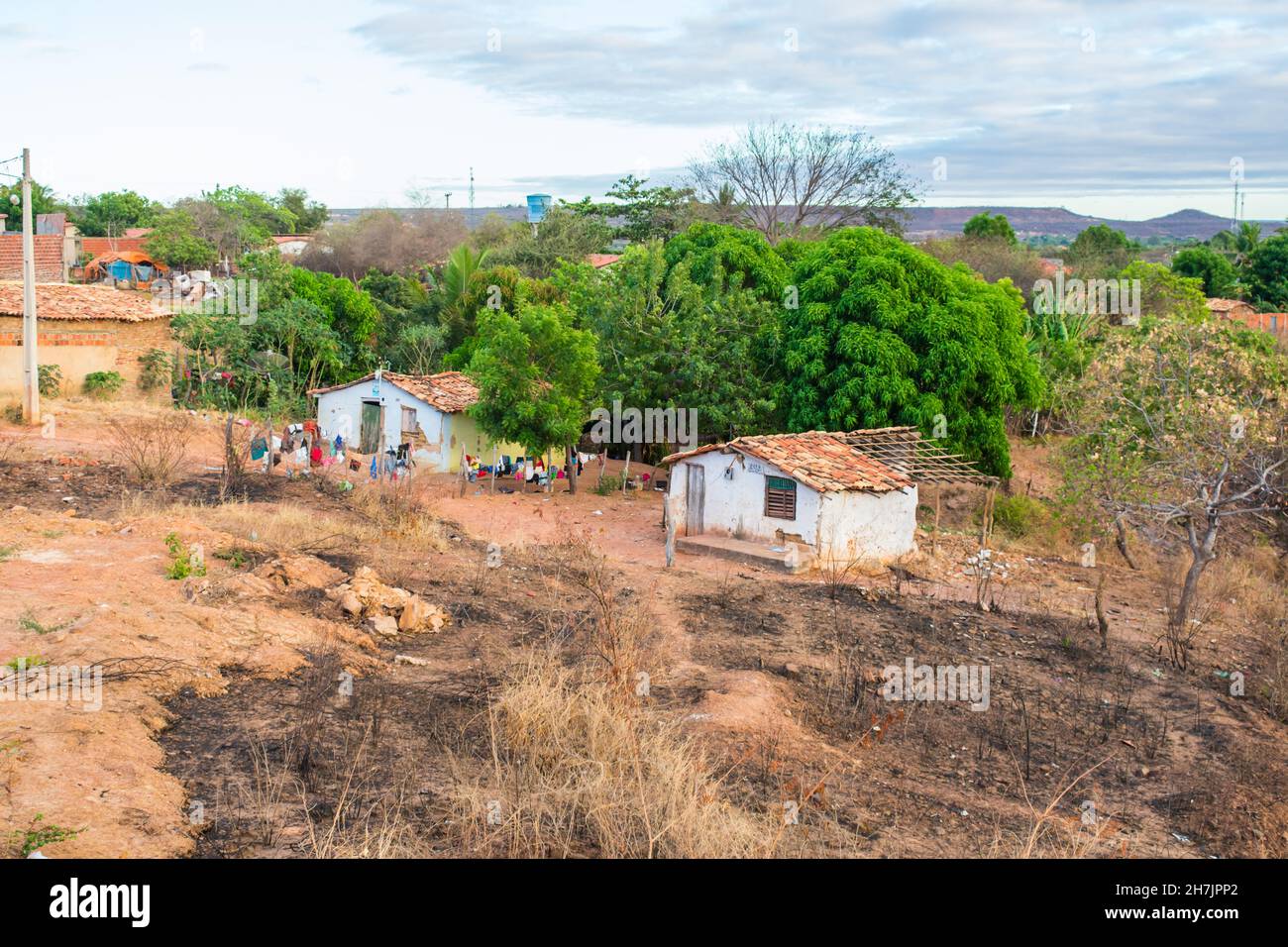 Poorly made houses with broken ceramic roof tiles in a settlement by ...