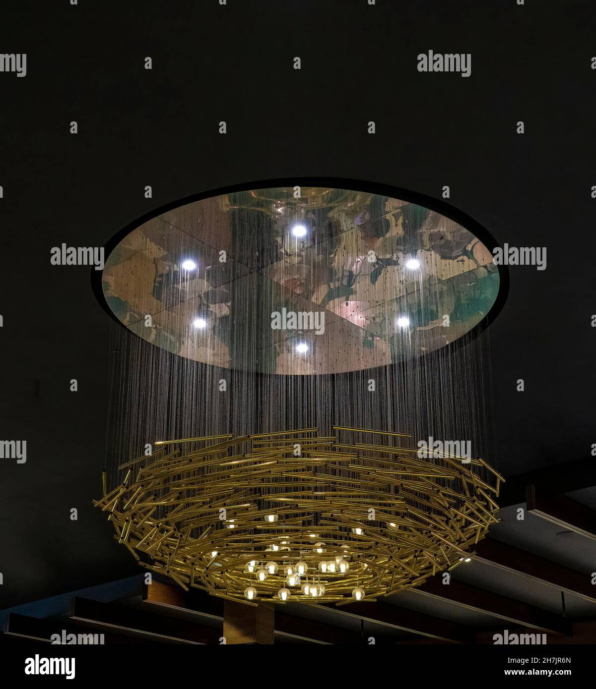 Elaborate and intricate light hanging from the ceiling of a shopping ...