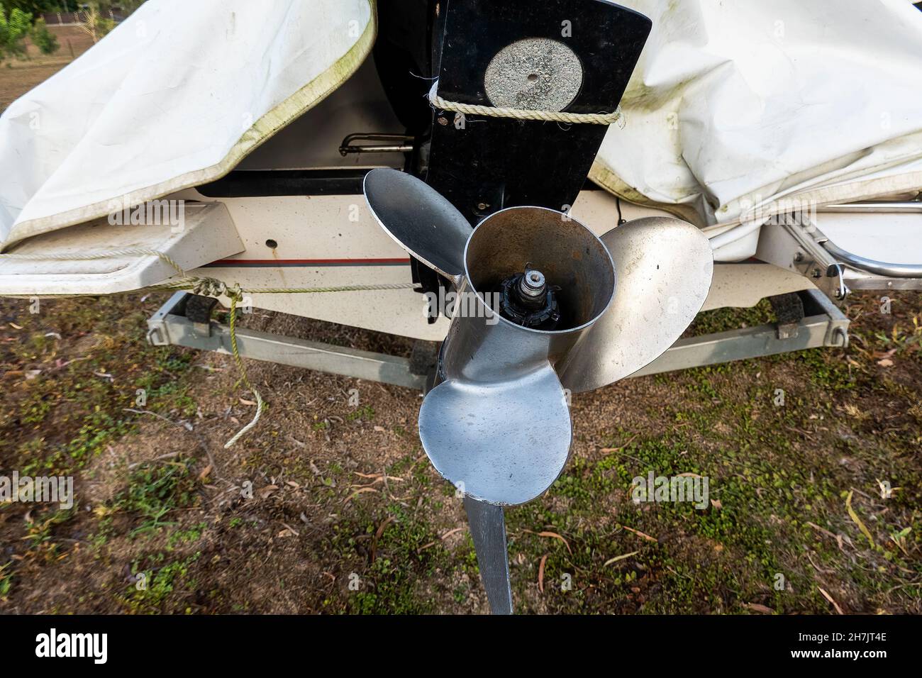 Close up of the propeller of a speed boat on a trailer in a backyard ...