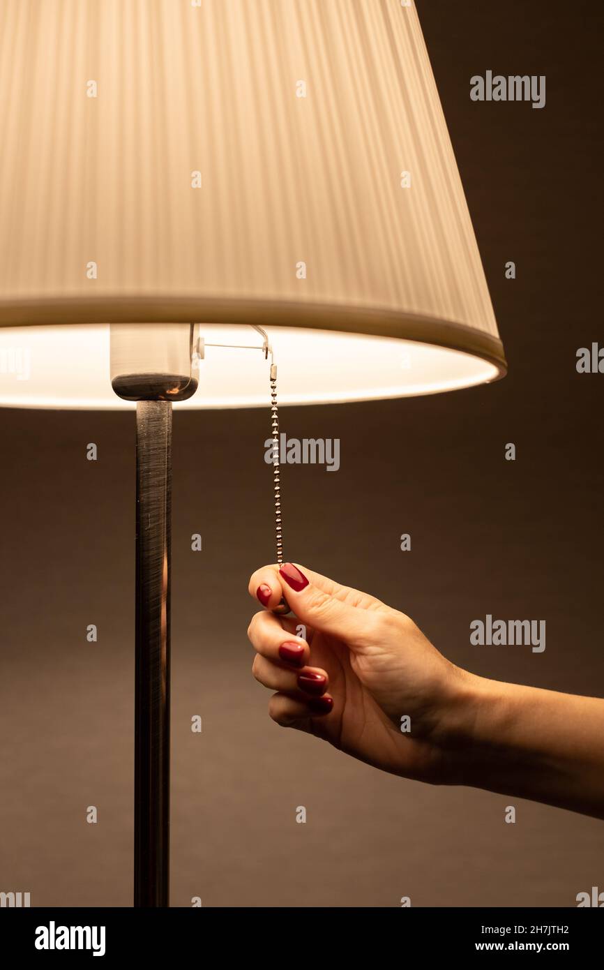 lamp night light by the rope which the hand pulls. High quality photo ...