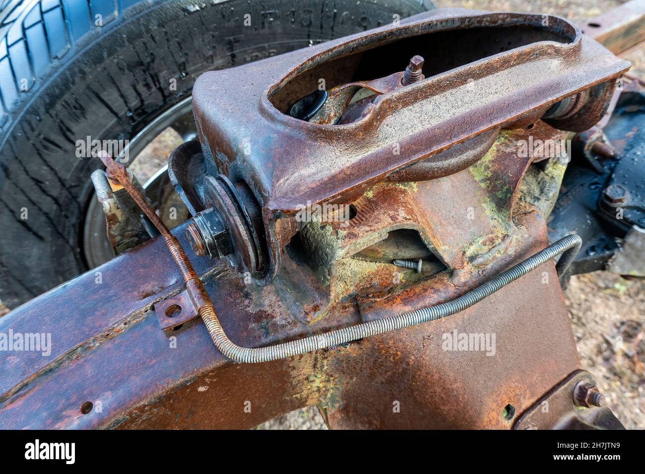 Rusted front suspension part of abandoned old car Stock Photo - Alamy