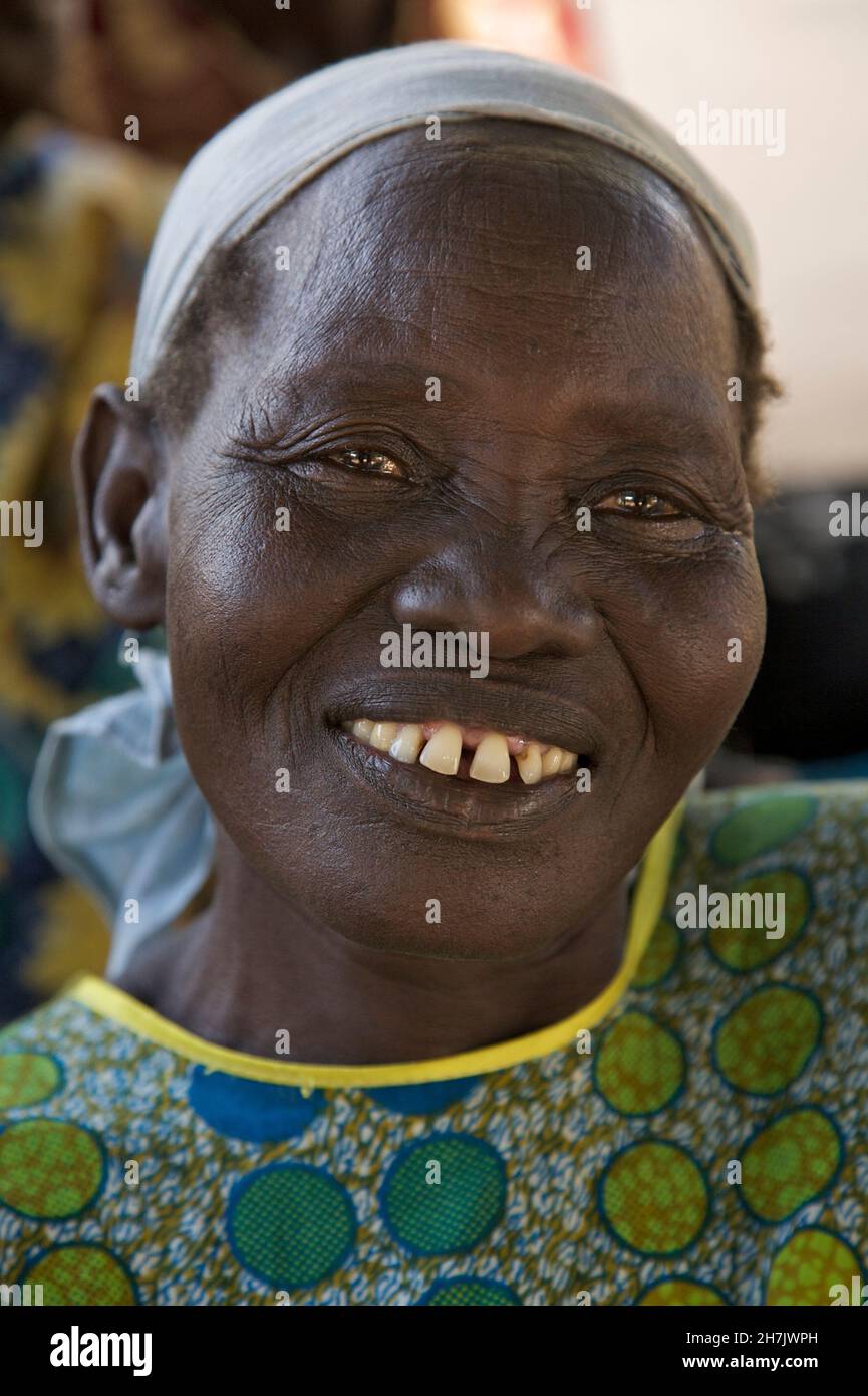 A woman smiles while attending a health forum on personal hygiene, in ...