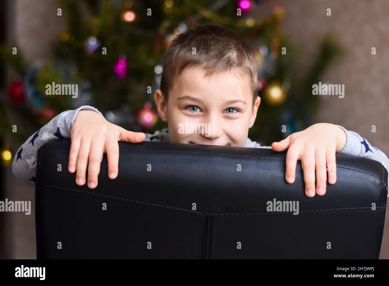Child behind chair hi-res stock photography and images - Alamy