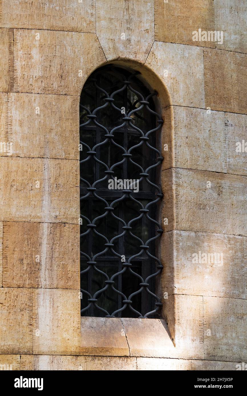 Landscape with a lattice window in the wall Stock Photo - Alamy