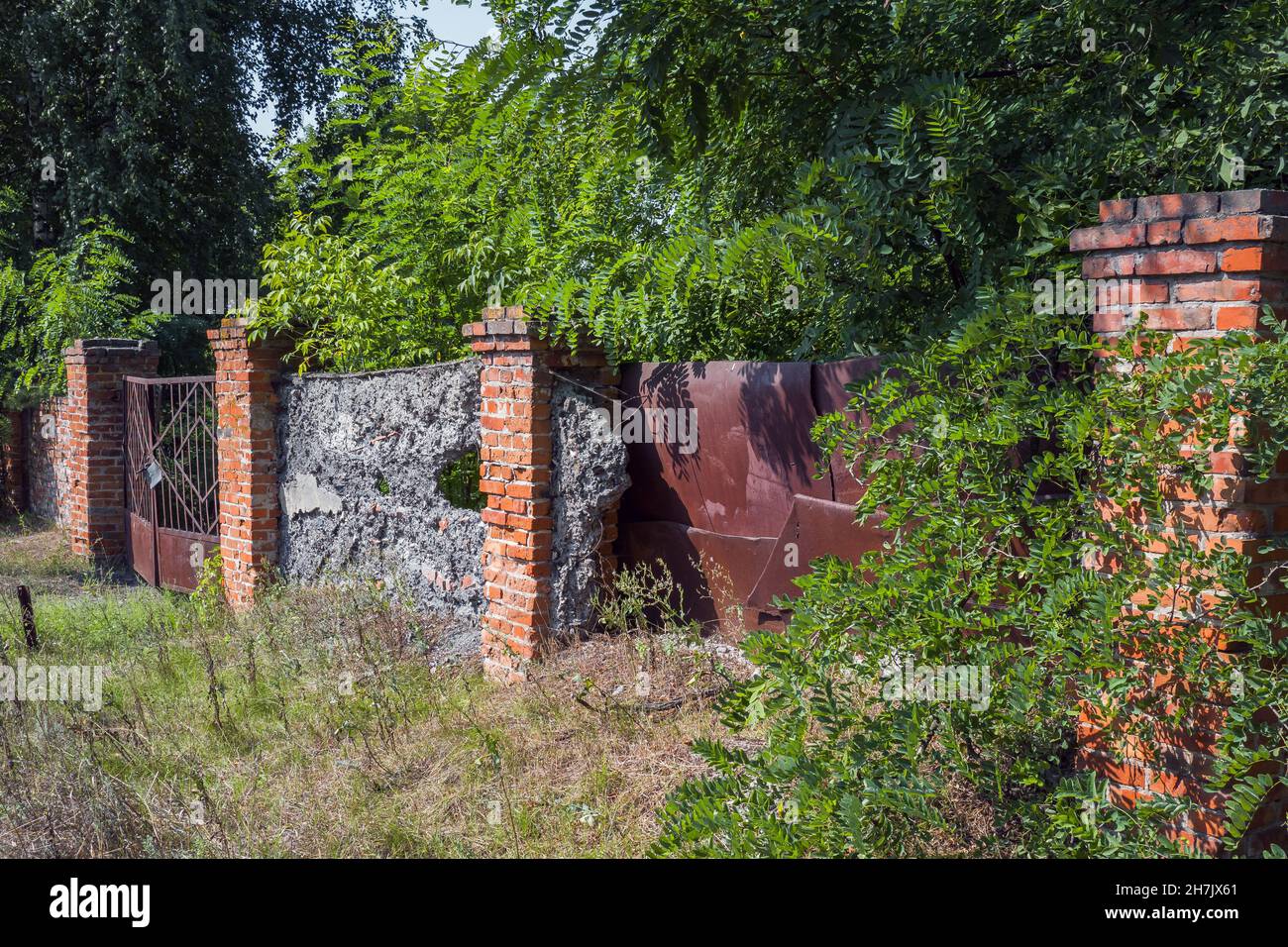 Landscape with an old breaking fence Stock Photo - Alamy