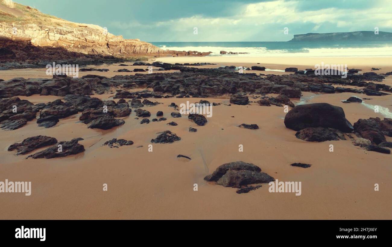 A photo of rocks on the beach Stock Photo - Alamy