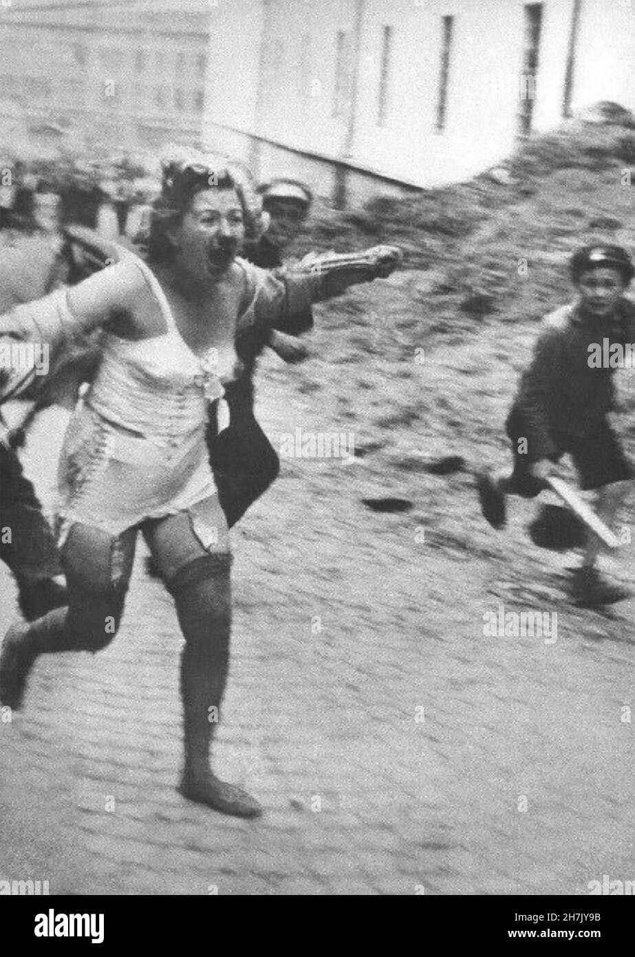 LVIV POGROM 1941. A Jewish woman is chased up Pompierska Street ...