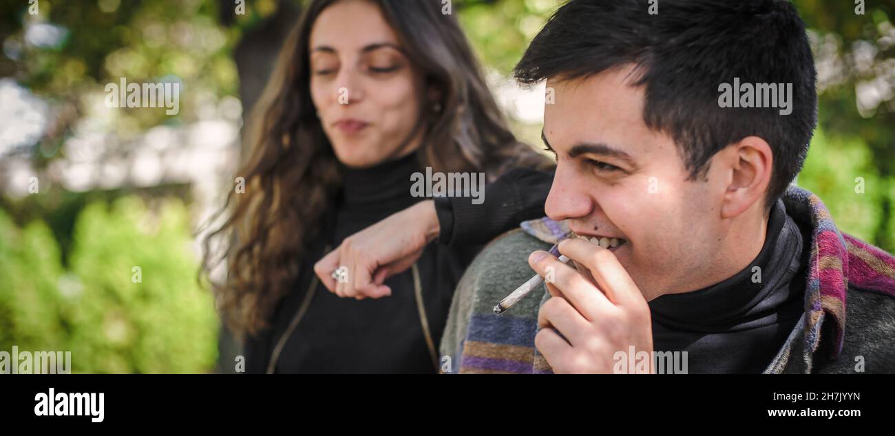 Woman smoking in park hi-res stock photography and images - Alamy