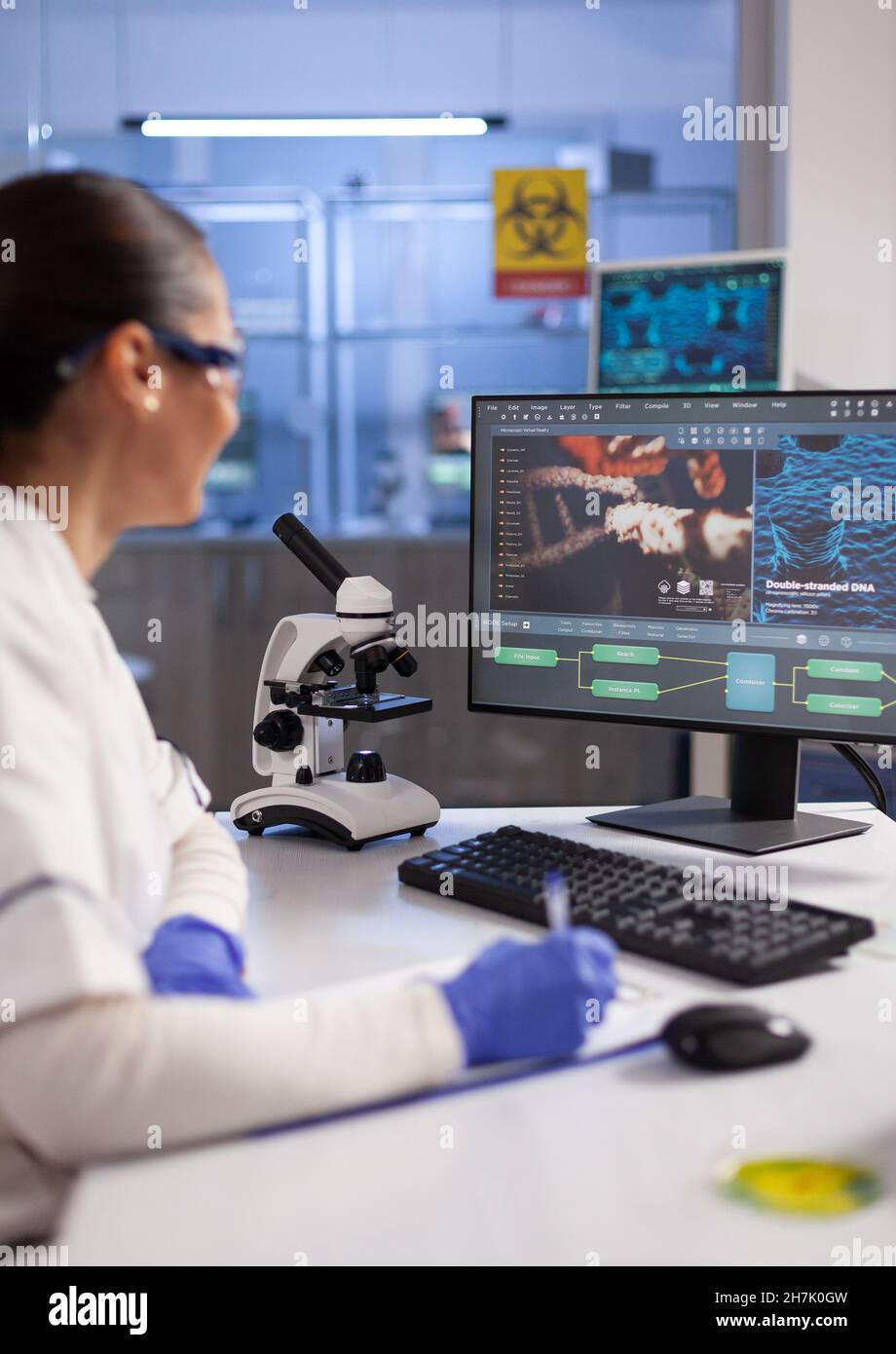 Specialist doctor analyzing virus expertise writing on clipboard during ...