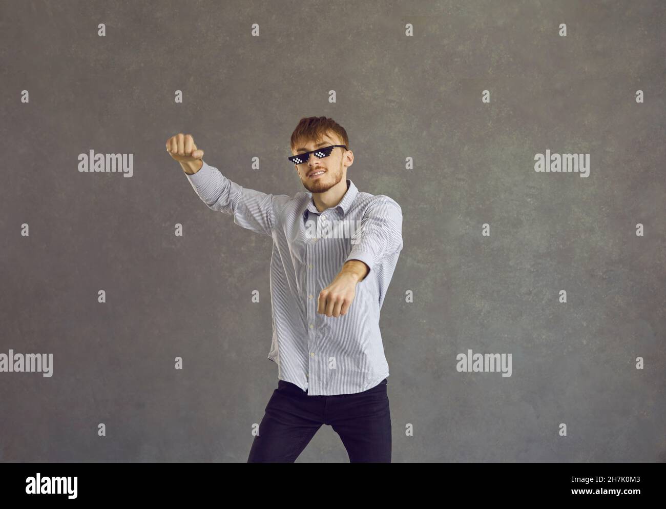Happy young man in thug life glasses dancing gangnam style isolated on ...