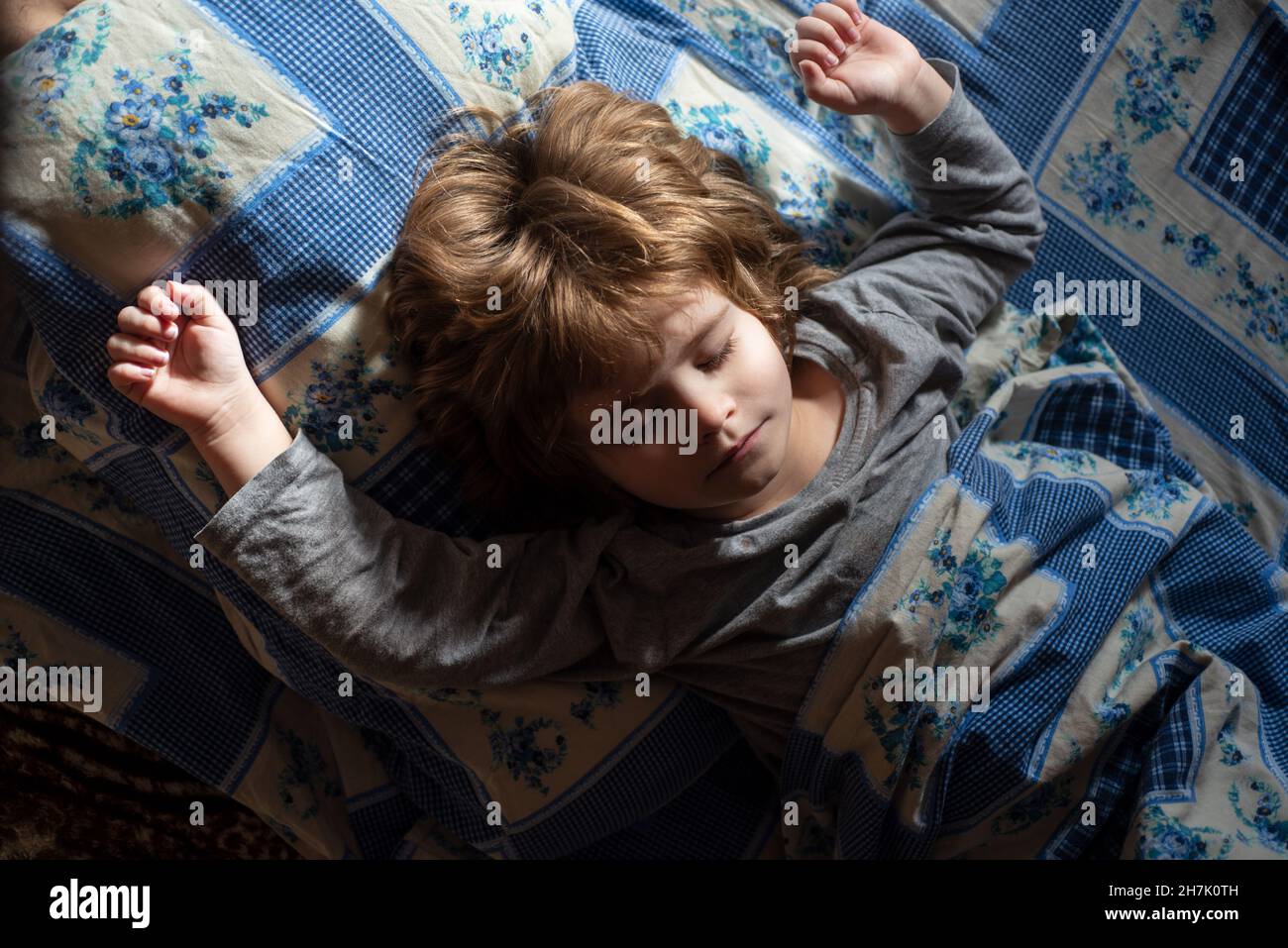 Child sleeping in the bed. Quiet sleep. Comfortable children sleepy at ...