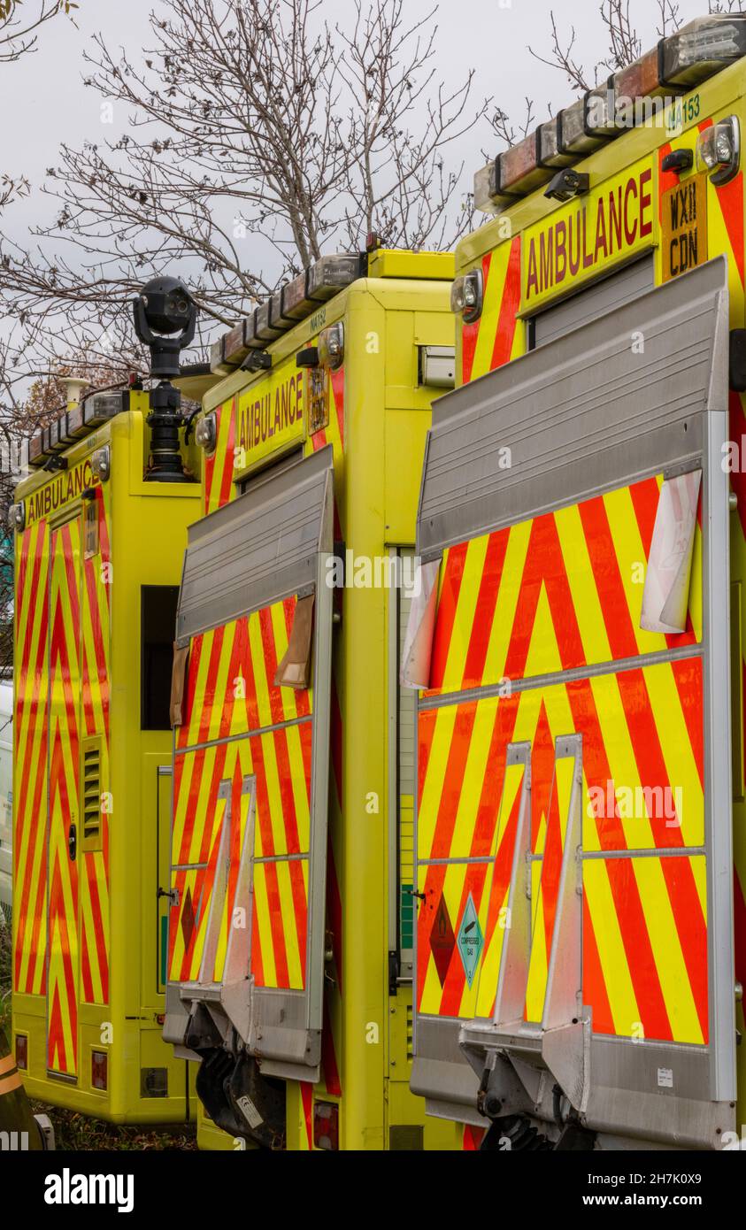 emergency NHS ambulances parked in a compound ready to respond to ...