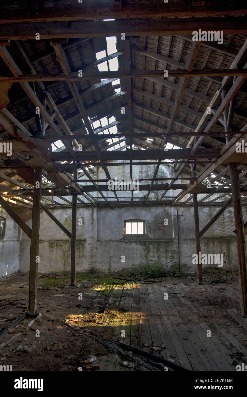 Old ruined warehouse that was almost demolished. The sky can be seen ...