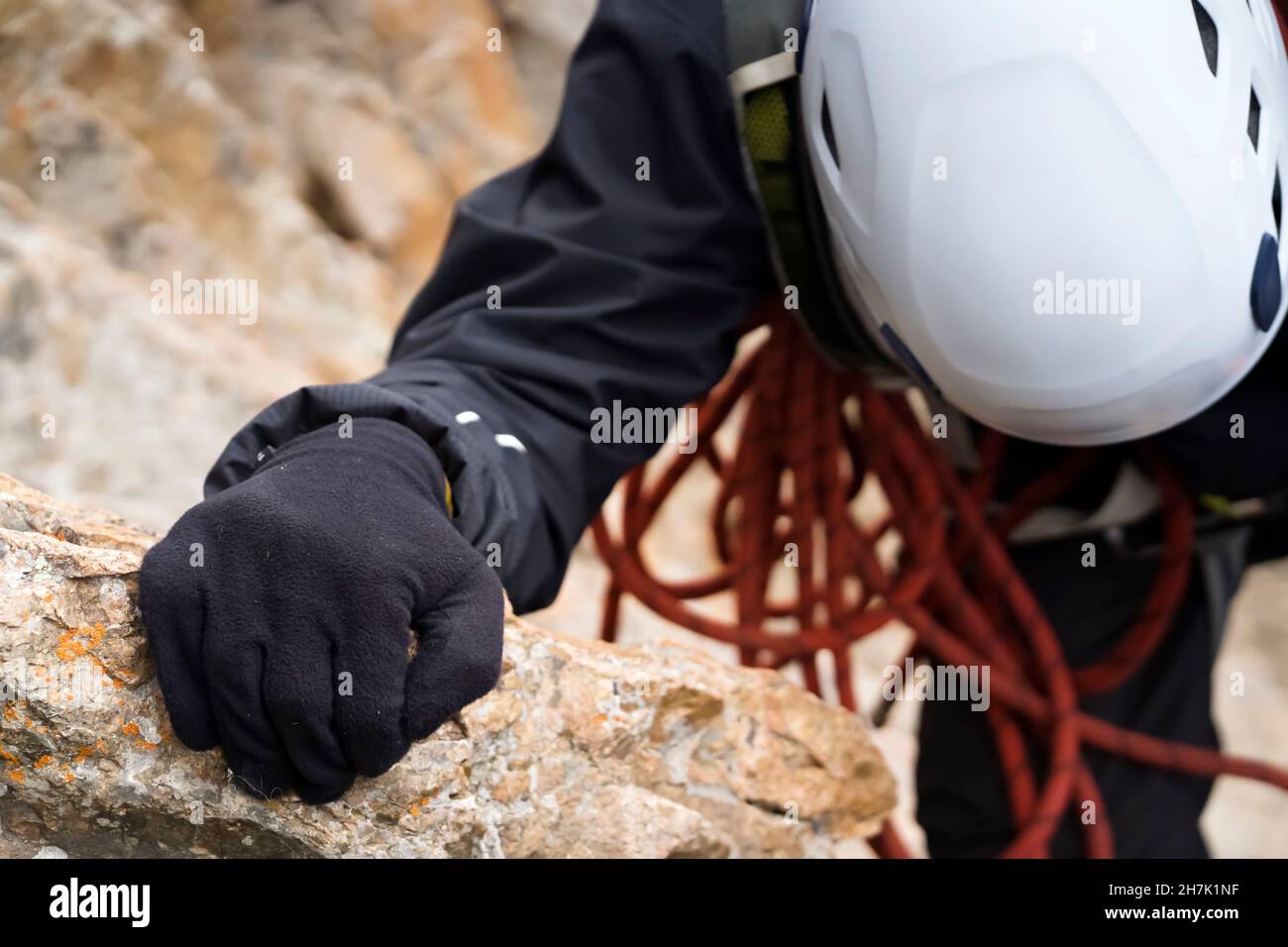 A hiker descends on a rope down the cliff Stock Photo - Alamy