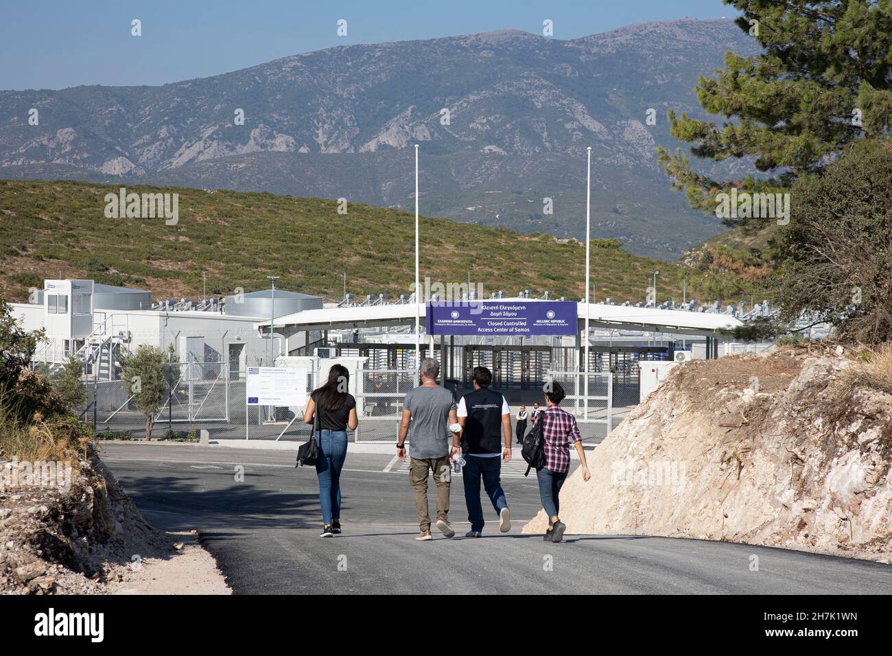 People seen moving towards the controlled entrance of the new refugee ...