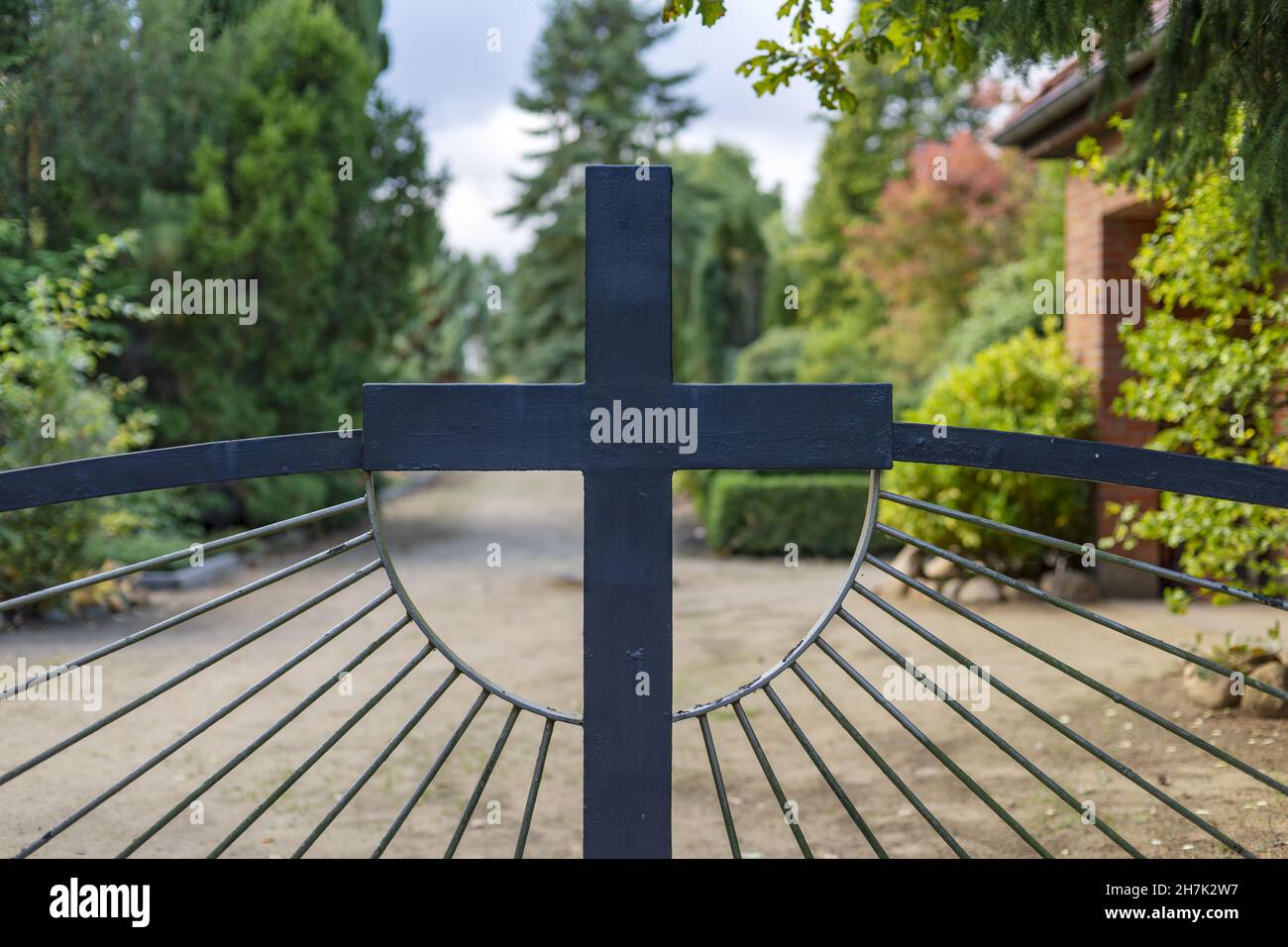 Cross of the entry of a cemetery Stock Photo - Alamy