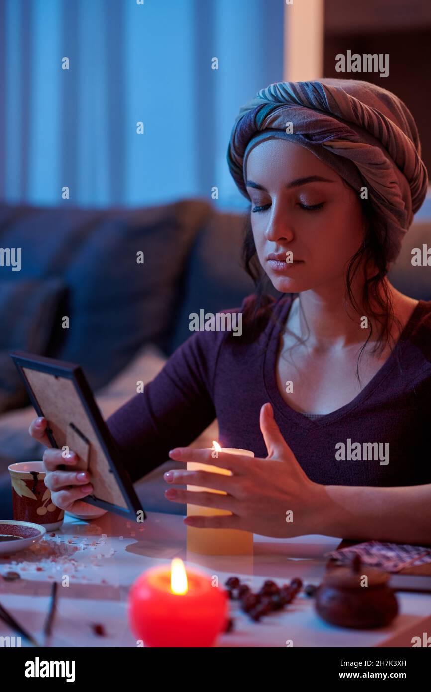 Woman with closed eyes performing a love magic ritual Stock Photo - Alamy
