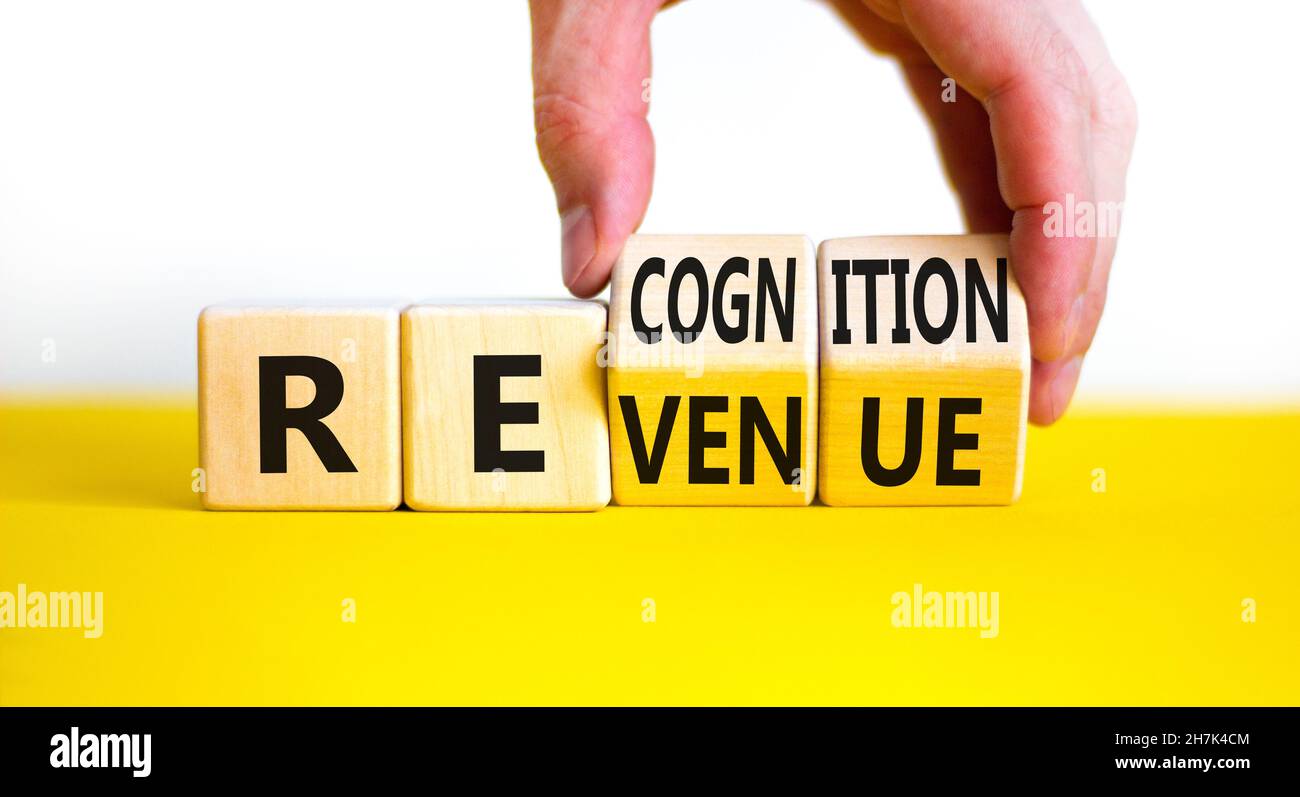 Revenue and recognition symbol. Businessman turns cubes and changes the ...