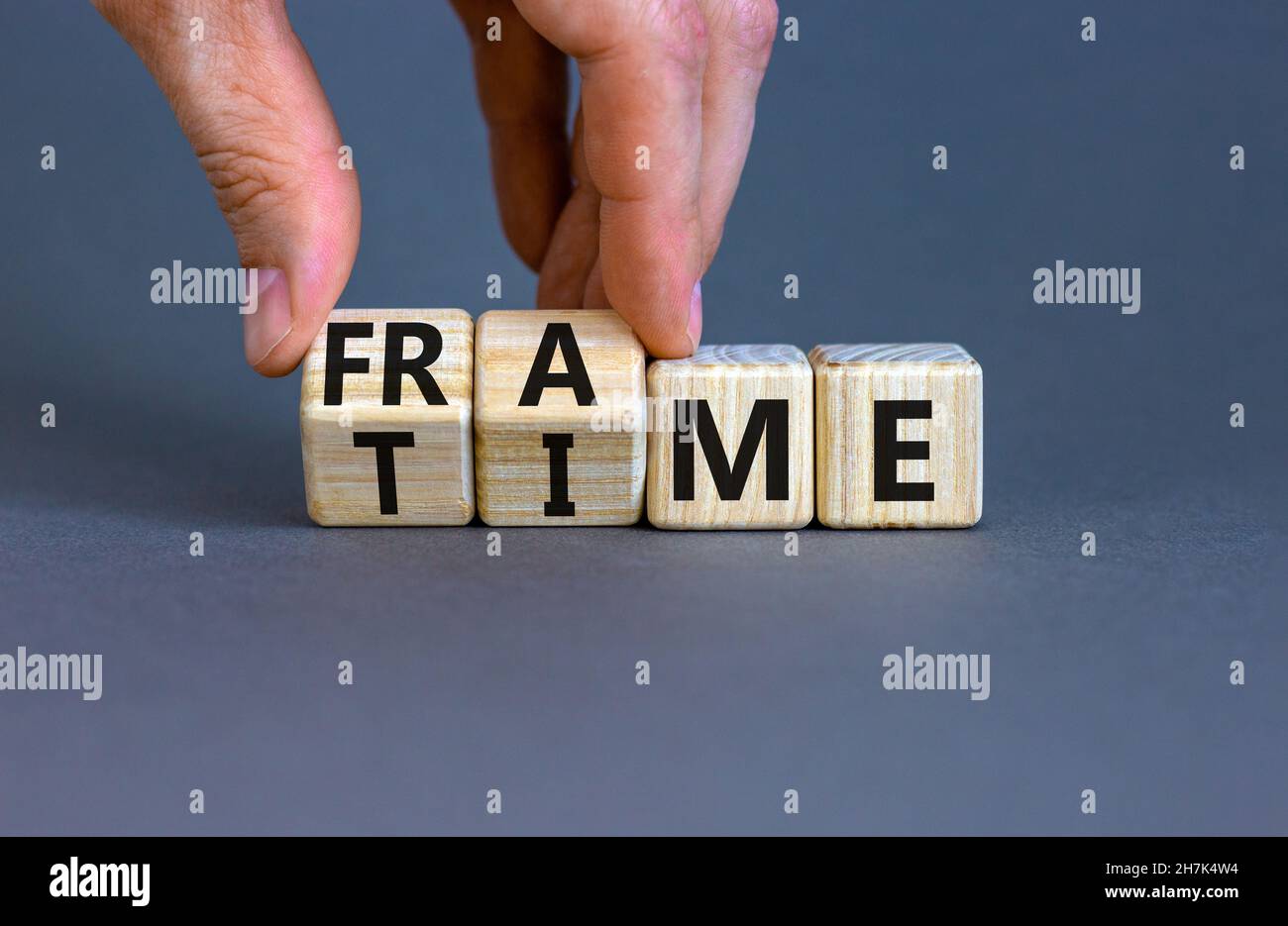 Time frame symbol. Businessman turns wooden cubes and change the ...