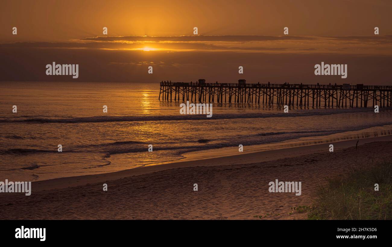 Golden Sunbeams Reflecting over a Fishing Pier on a Florida Morning ...