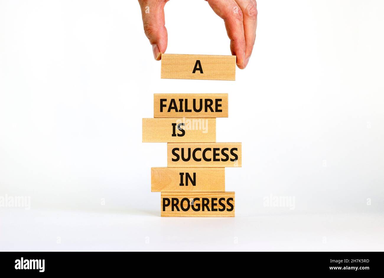 Failure or success symbol. Wooden blocks with words A failure is ...