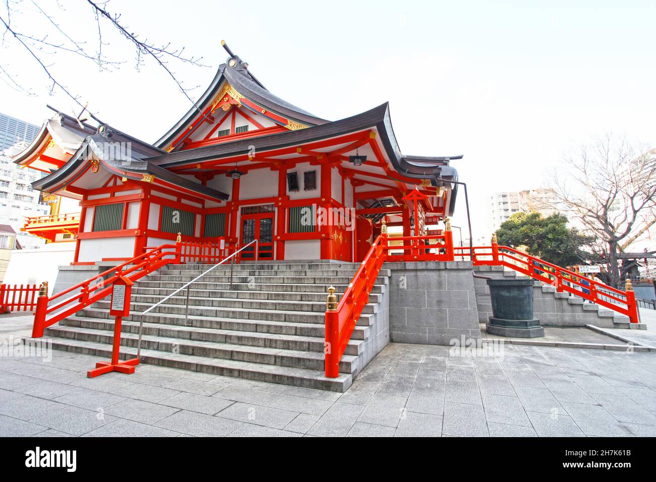The Hanazono Shrine with vermilion colored buildings and torii gates in ...