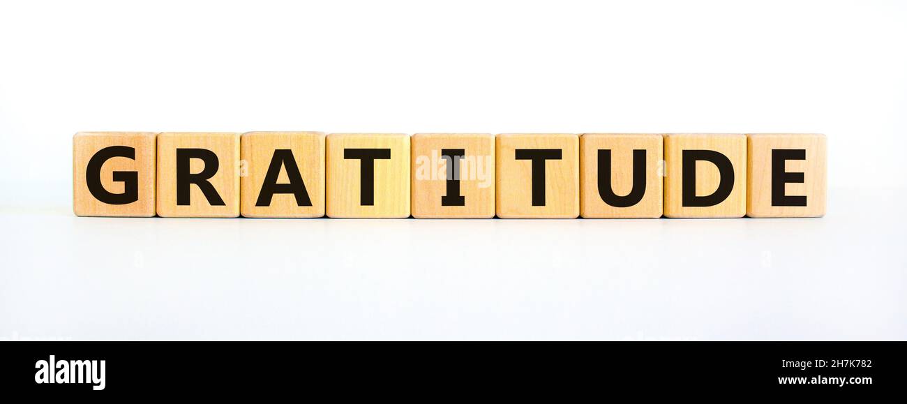 Gratitude symbol. The concept word Gratitude on wooden cubes. Beautiful ...