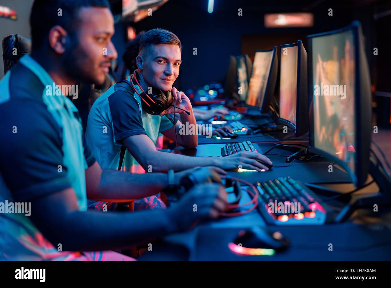 Professional gamer participates in team play in cyber club Stock Photo ...