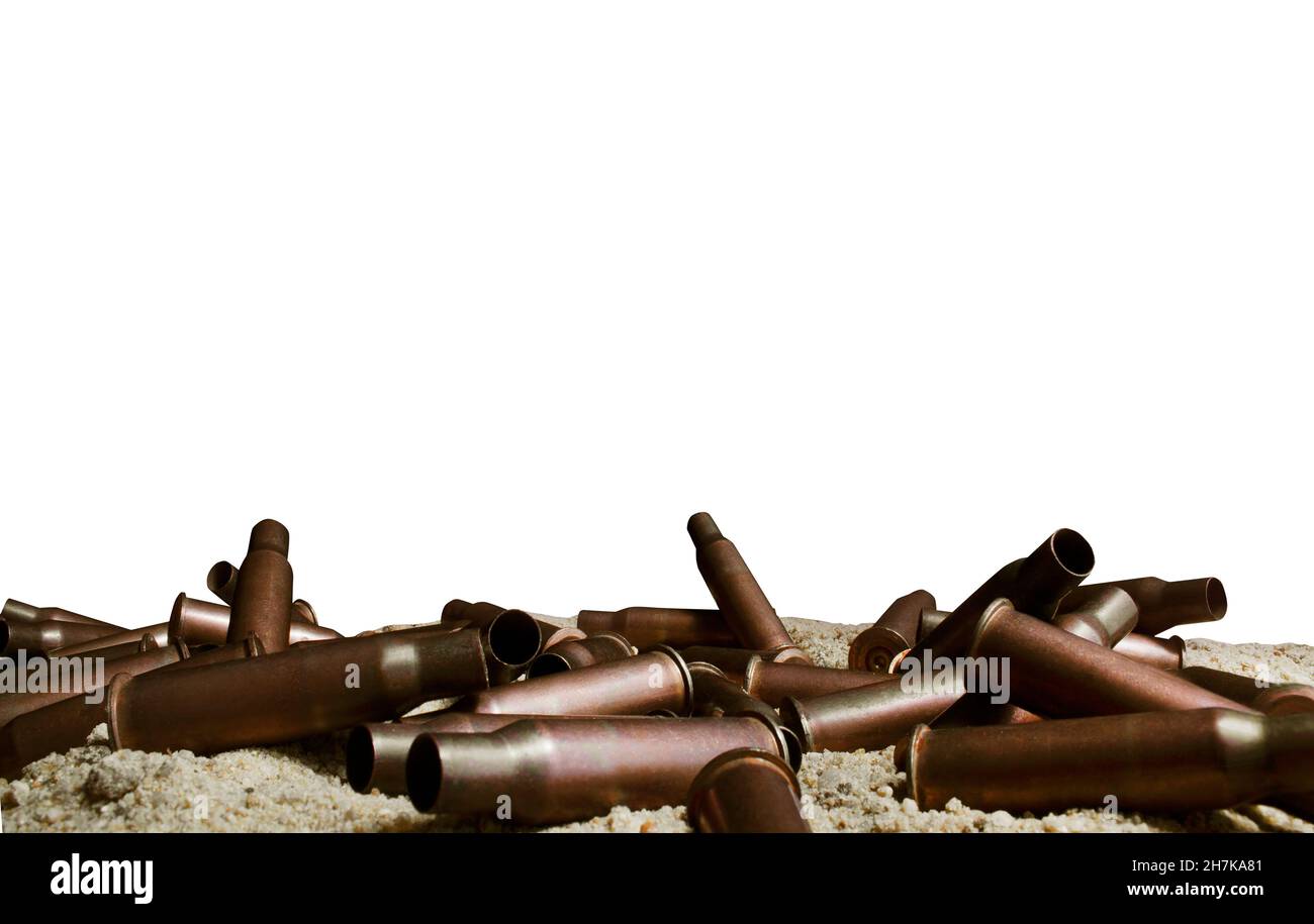 Isolated close-up photo of metal bullet gun shells laying on sand ...