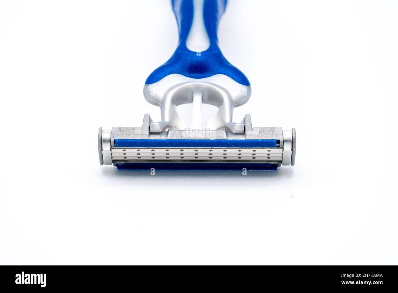 triple blade razor head in blue and gray colors on light background ...