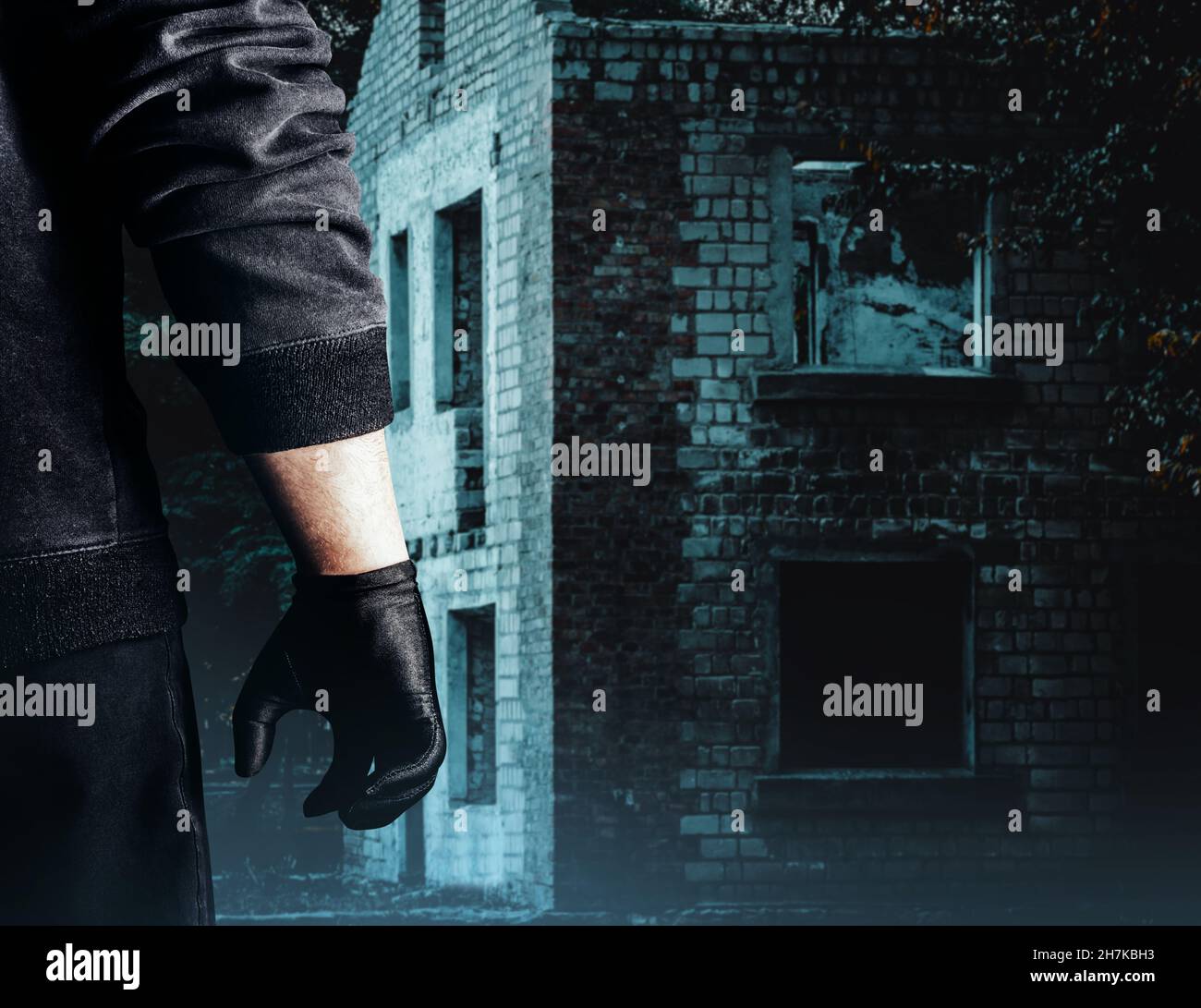 Photo of dangerous criminal stalker man in black outfit and gloves ...