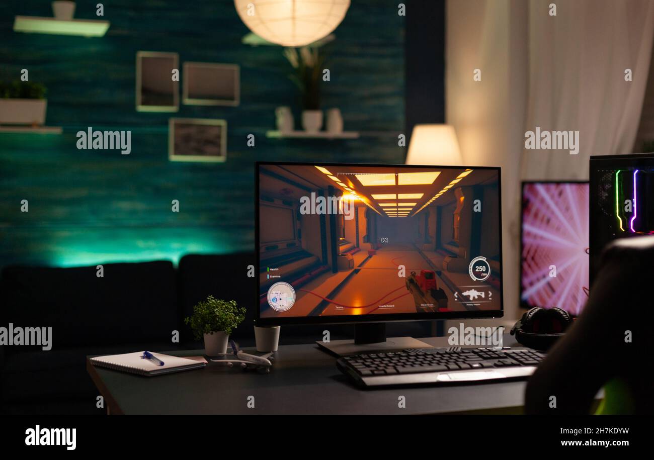 Empty room with online video games on computer to play with controller ...